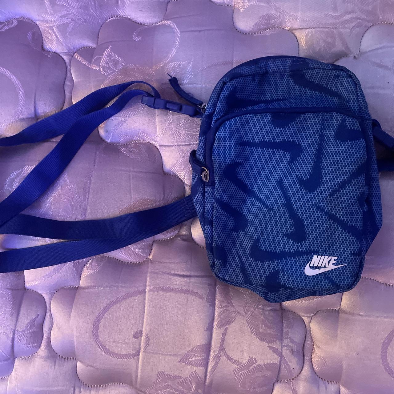 blue Nike shoulder bag with a repeated dark blue... | Depop