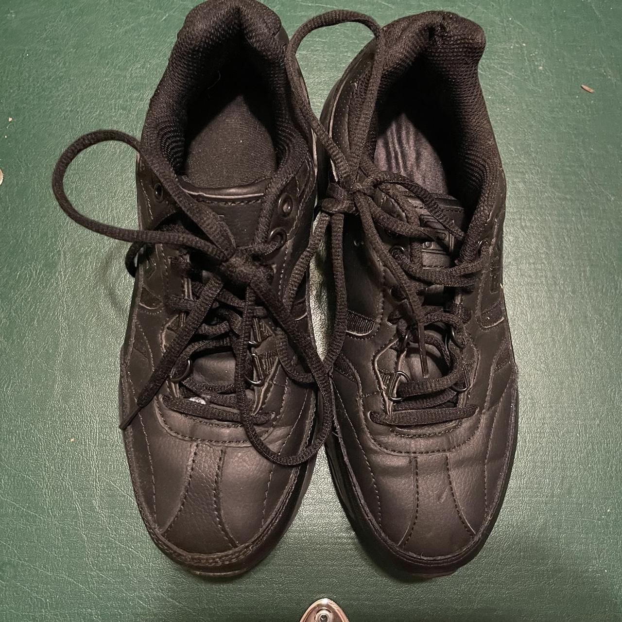 These are Fila black gym shoes their size 7 barely... - Depop