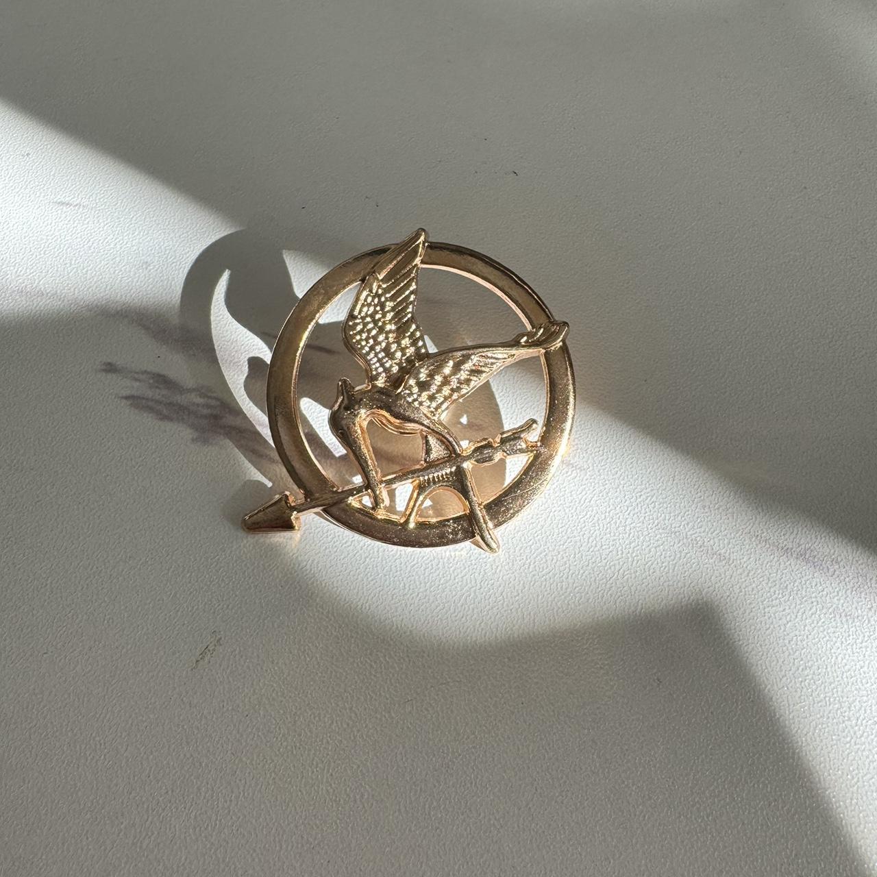 Hunger games gold mockingjay pin!! #hungergames... - Depop