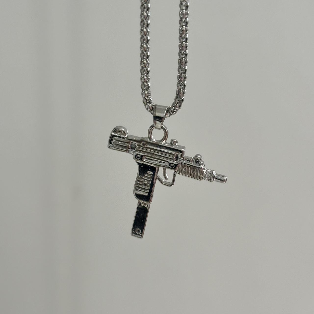 y2k 2000s silver mini uzi pendant necklace. 24... - Depop