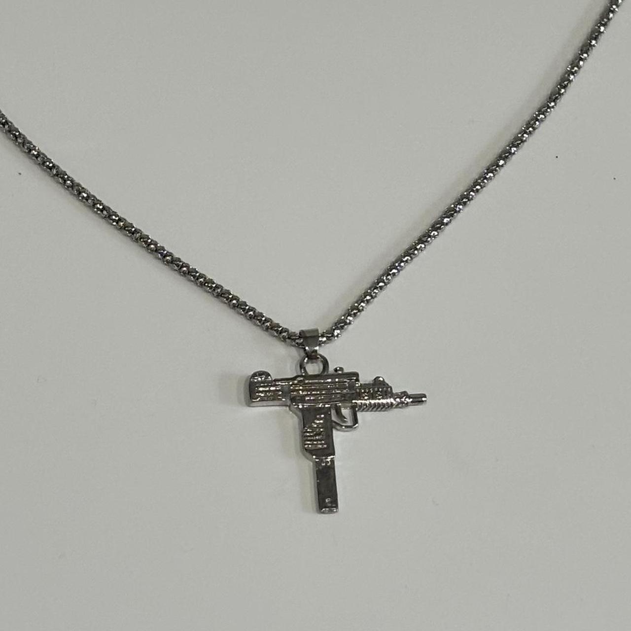 y2k 2000s silver mini uzi pendant necklace. 24... - Depop