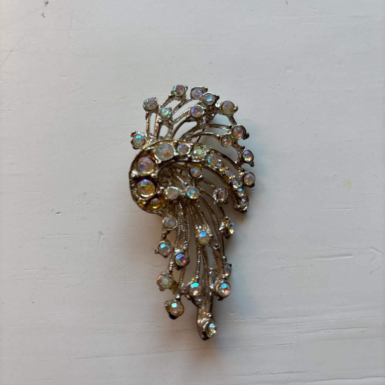 vintage silver rhinestone brooch shaped like a wing - Depop