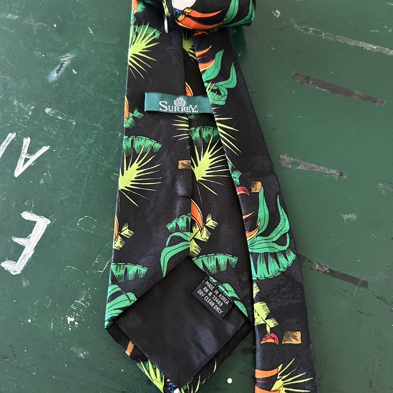 Surrey Tucan tie, black with tucan design - Depop
