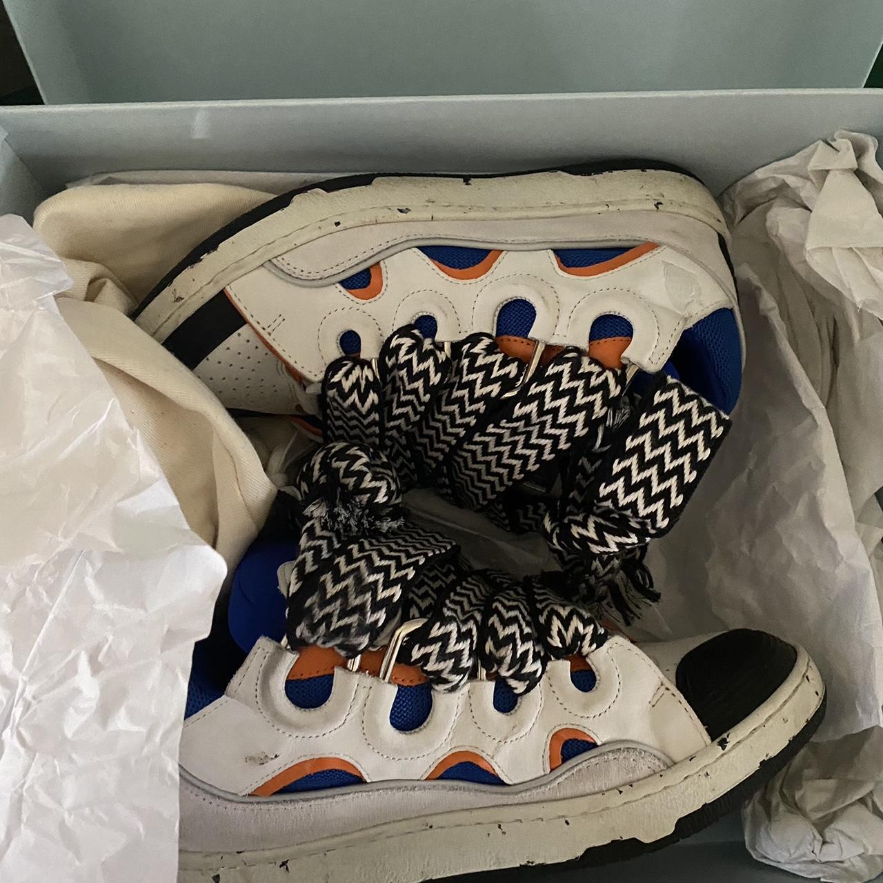 Multi color lavins blue/white/orange slightly worn... - Depop