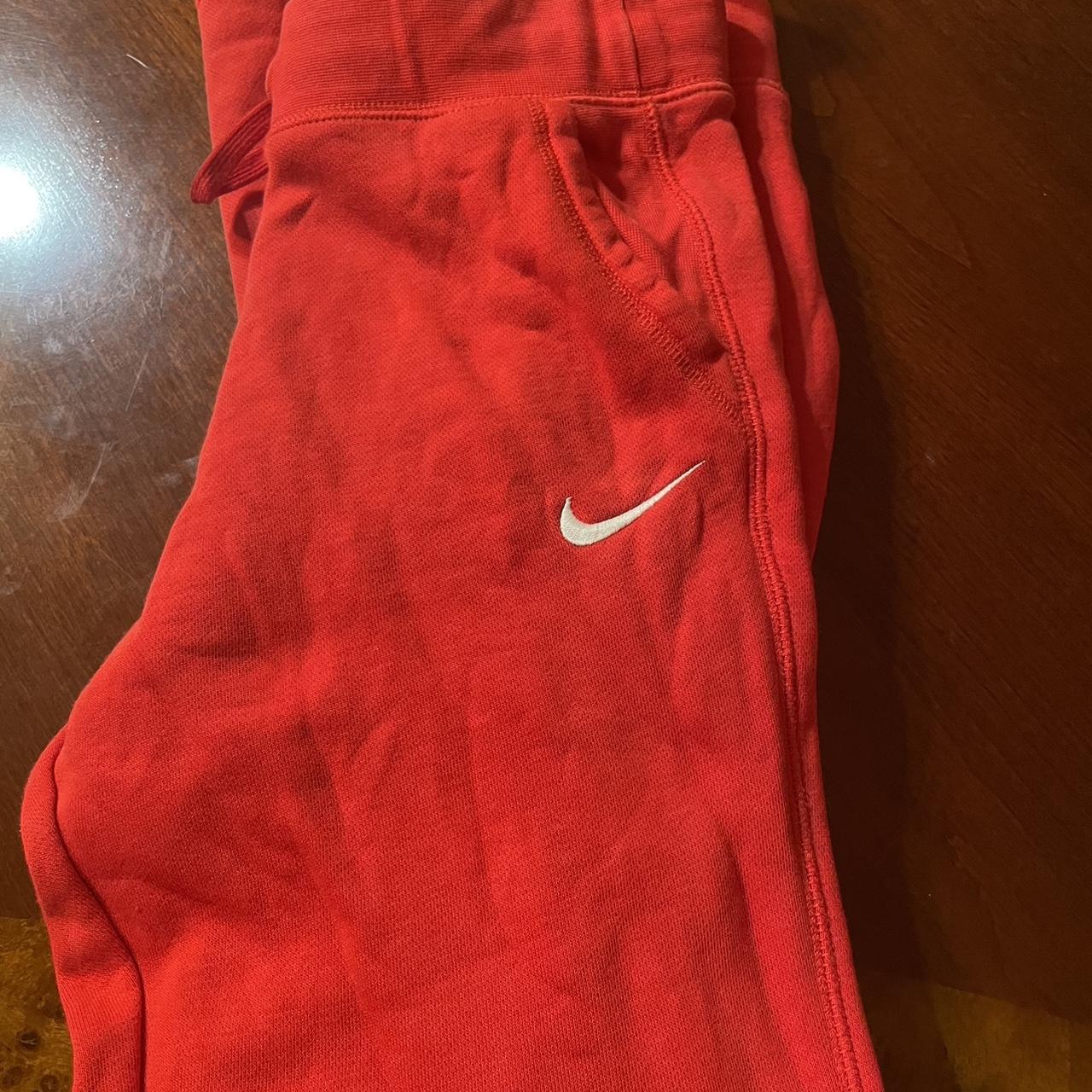 Red nike flare sweatpants. size xs women’s - Depop