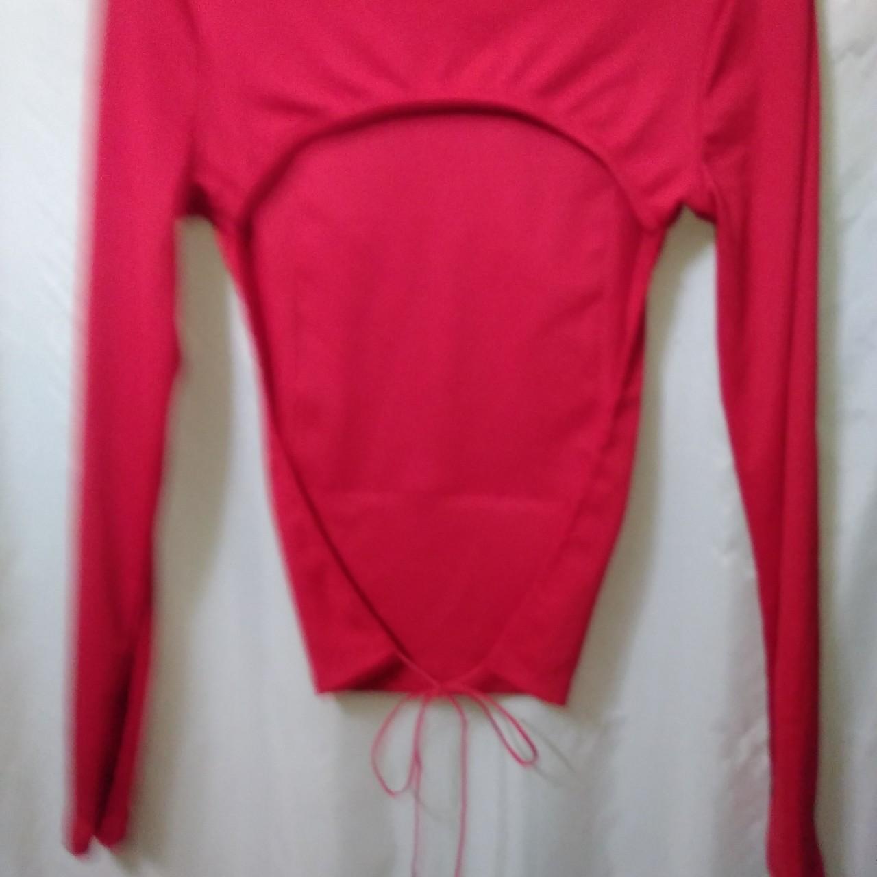 Red high heel print open back fits more like a medium. - Depop