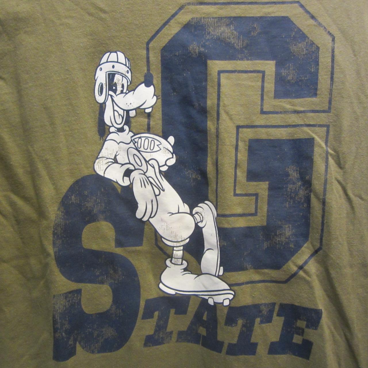 DISNEY STORE GOOFY FOOTBALL GRAPHIC TEE, OLIVE... - Depop
