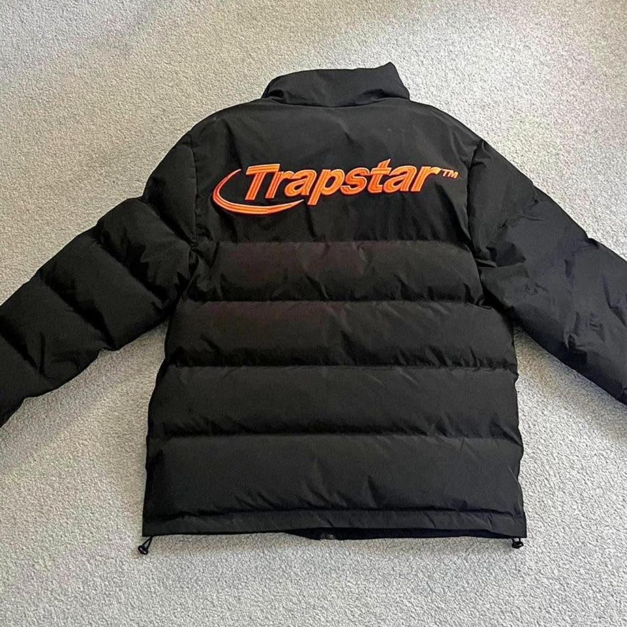 black and orange trapstar puffer in great condition... - Depop