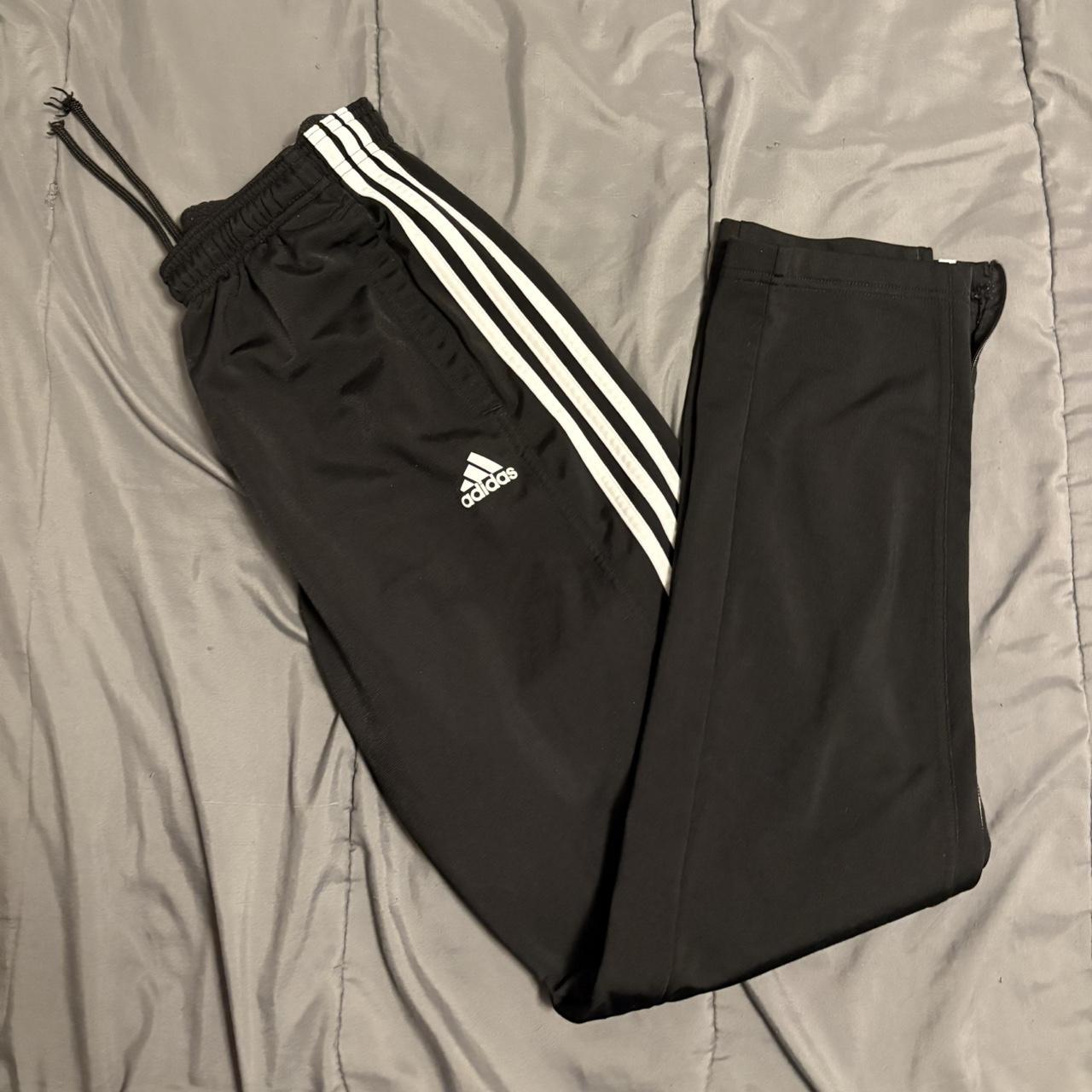 Adidas track pants with zippers on the... | Depop
