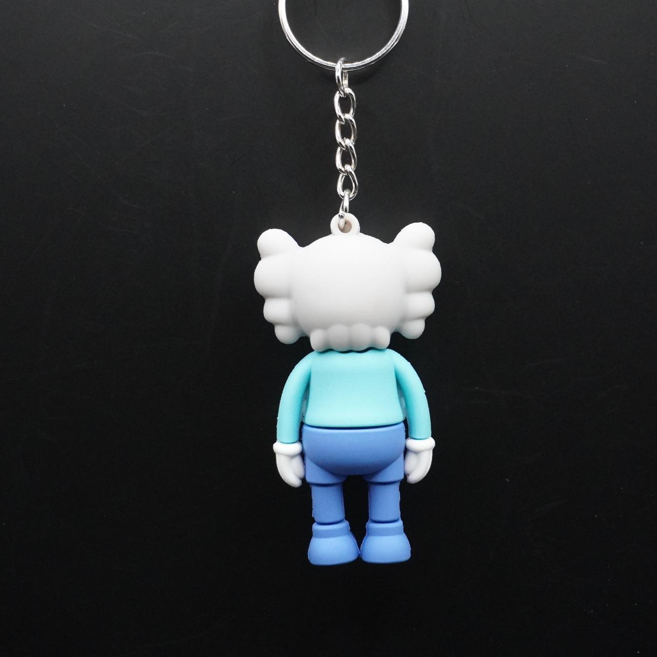 This KAWS Action Figure Pendant is the perfect... - Depop