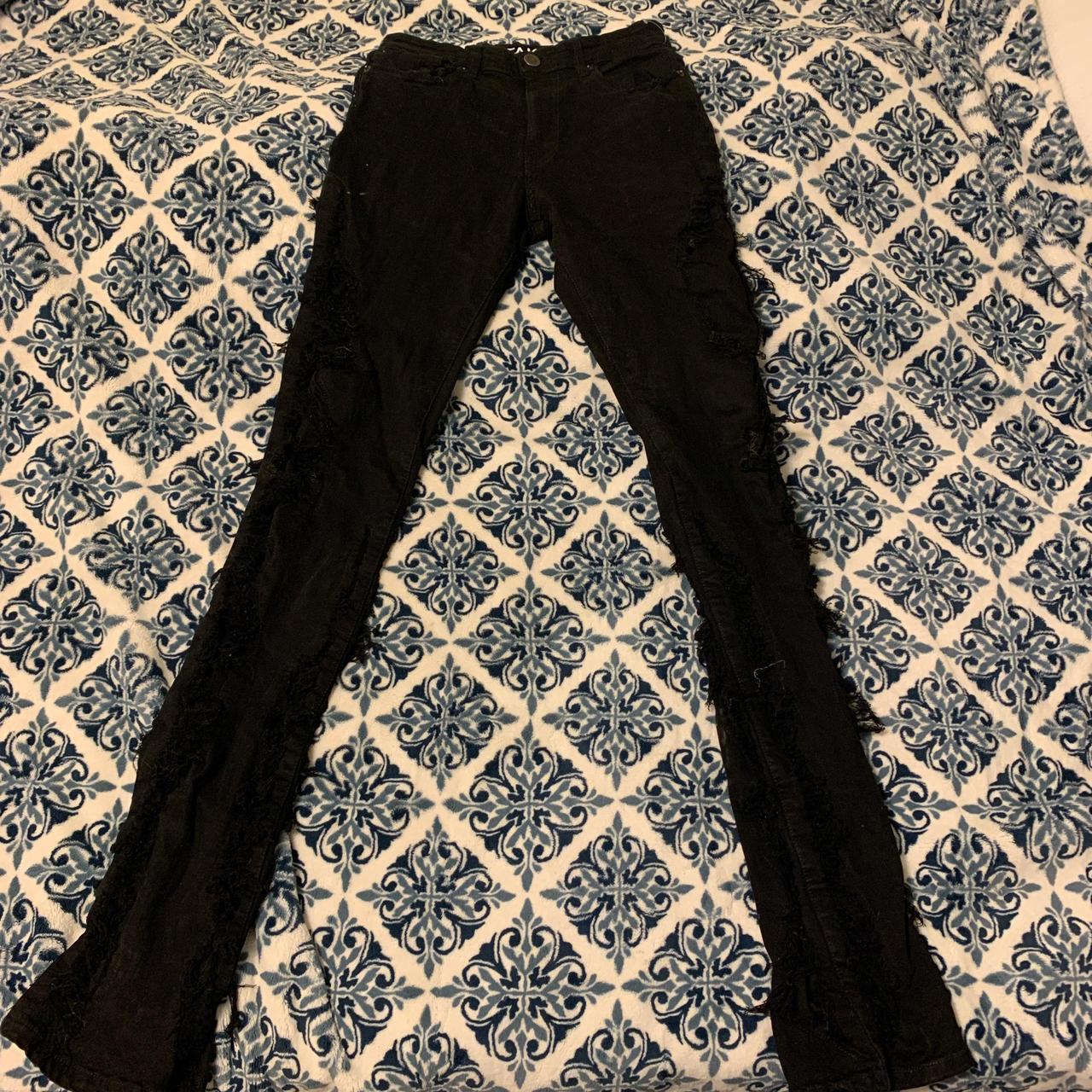 Black stacked jeans with fraying and slight flare in... - Depop