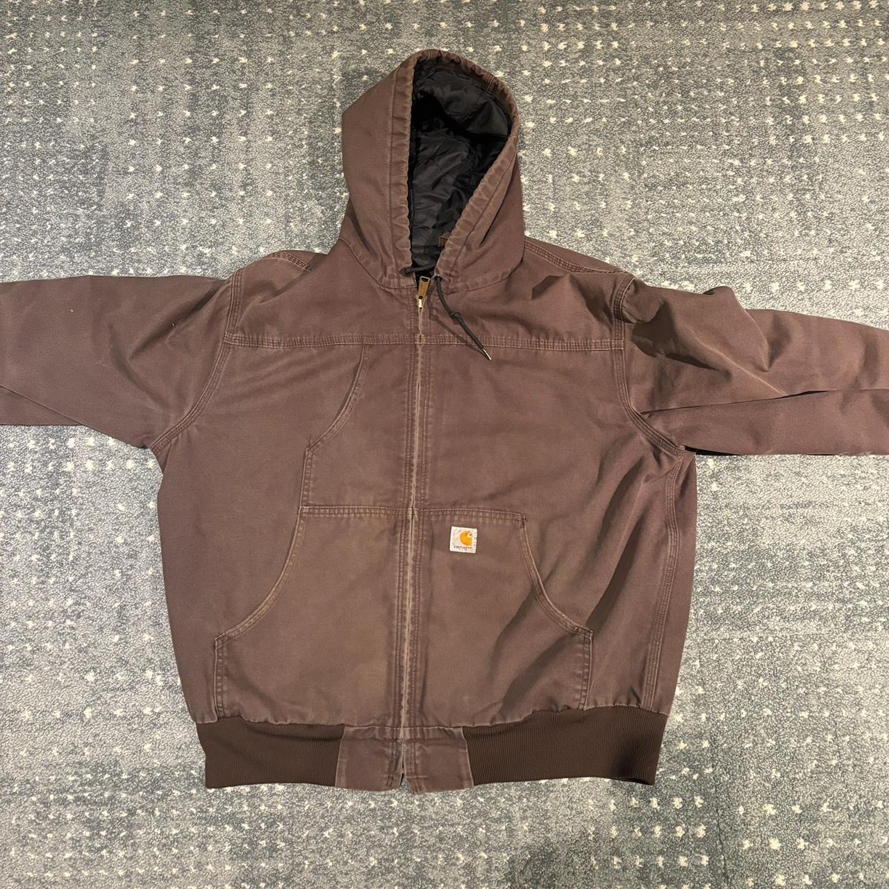 Brown Carhartt jacket with a worn look... - Depop