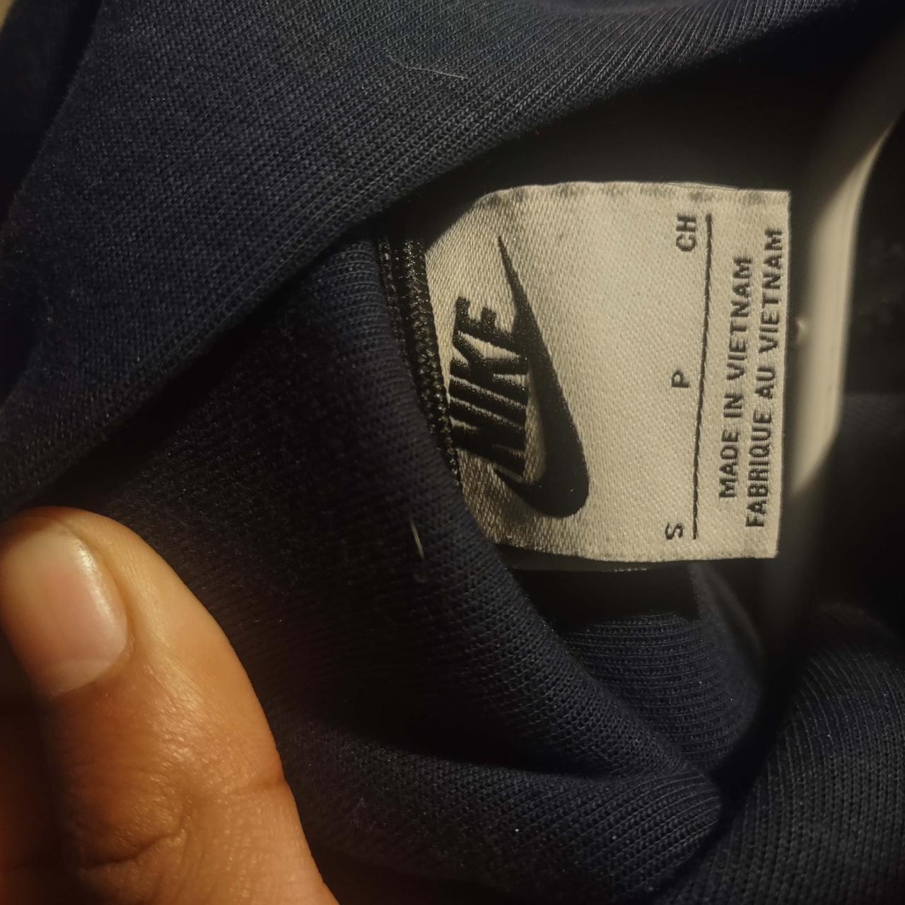 Small navy blue tech, small hole on the bottom left... - Depop