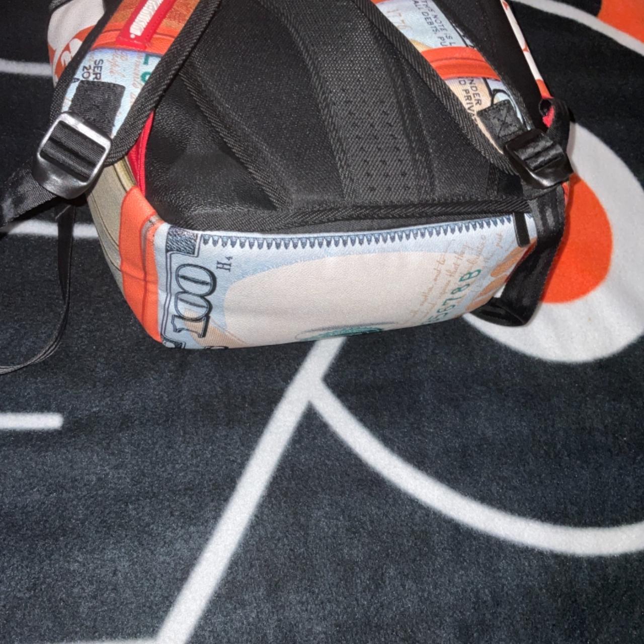 Money bag Sprayground backpack Signature formed by... - Depop