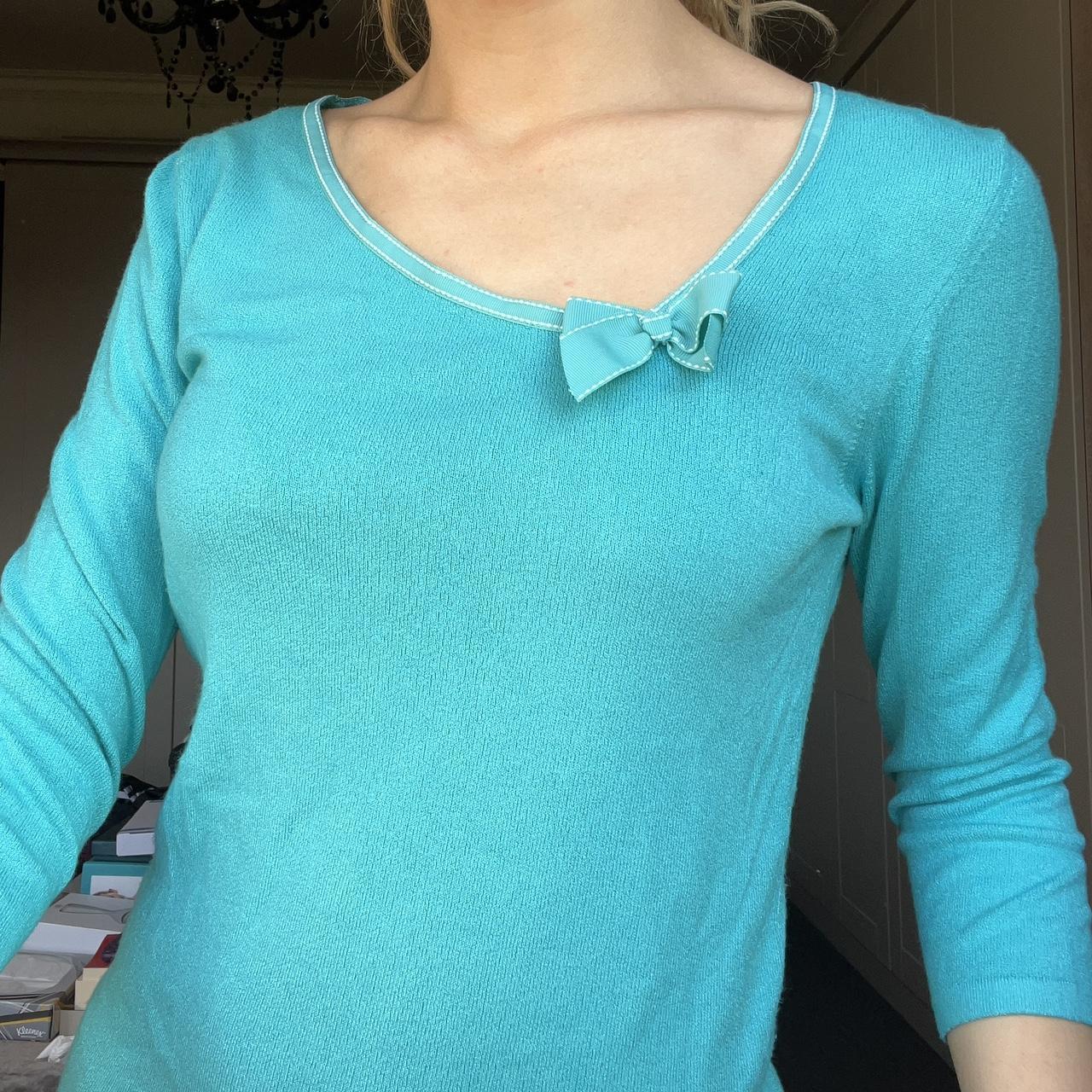 Per una blue / turquoise top V neck with a bow... - Depop