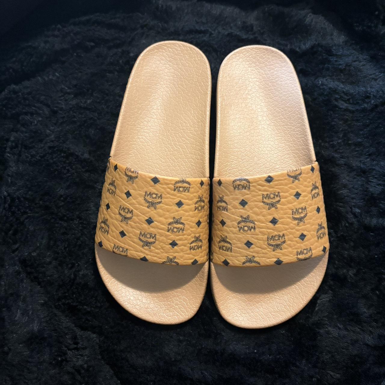 Cognac MCM slides never worn. Been in the box since