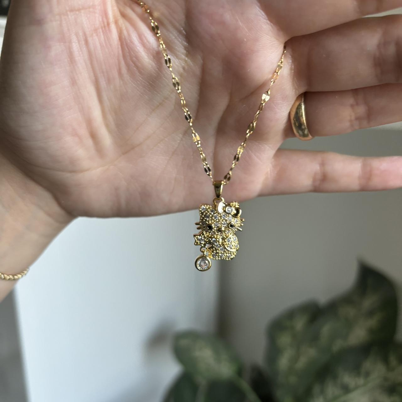 Gold Hello Kitty Rhinestone necklace with dangle... | Depop