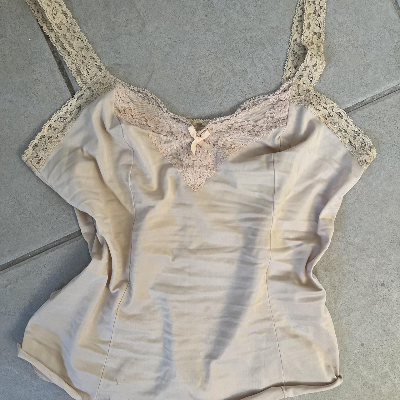 The prettiest cream lace cami top with a bow in the... - Depop