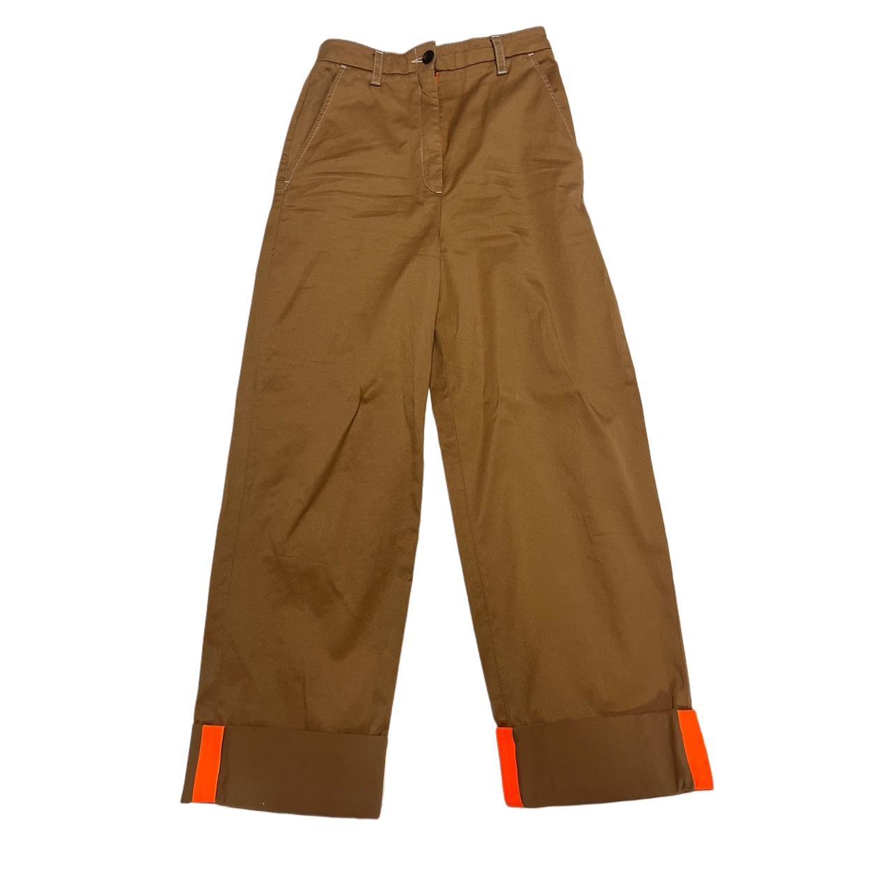 These tan pants feature a sleek design with a fun... - Depop