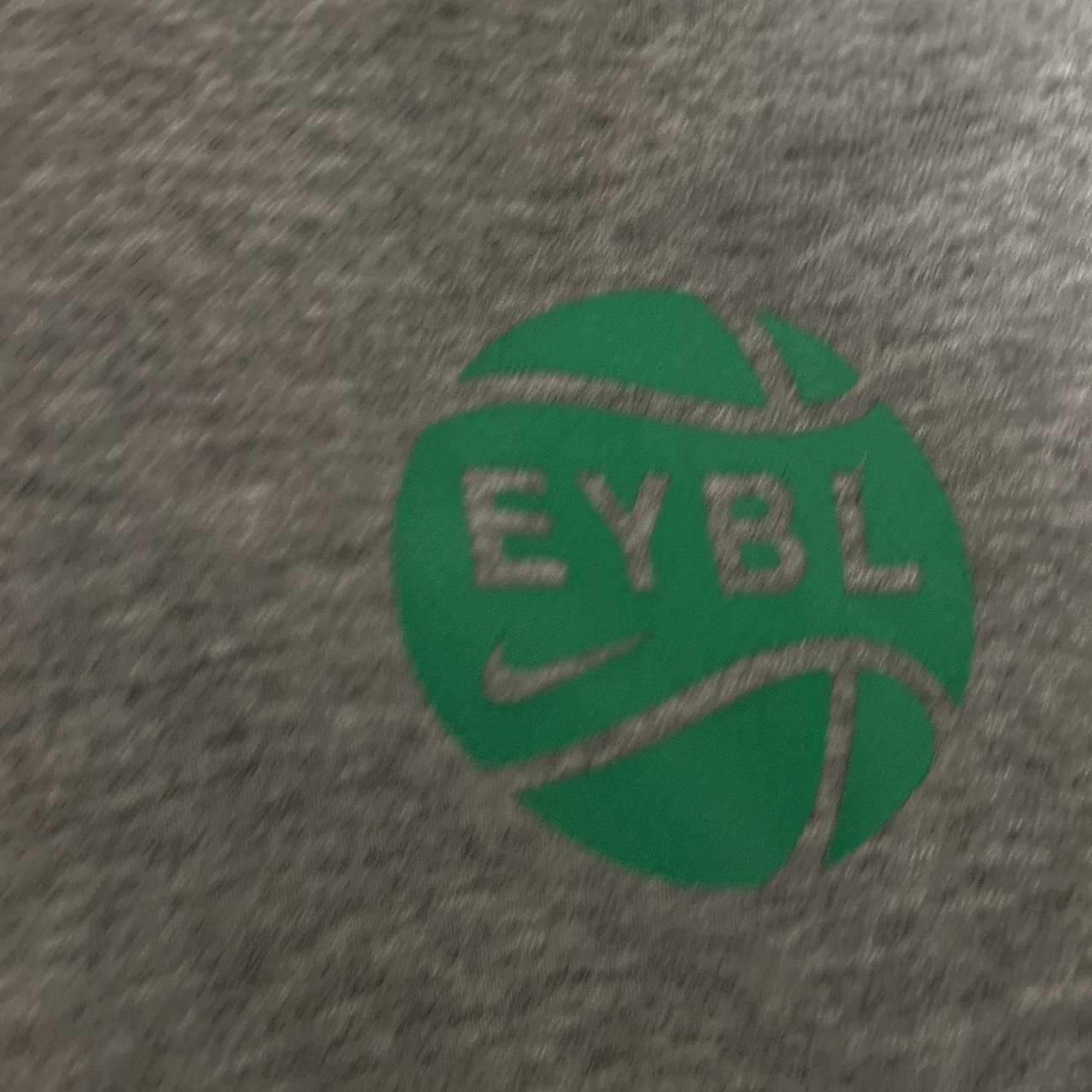 Grey Nike eybl hoodie with green font. Medium fits... - Depop