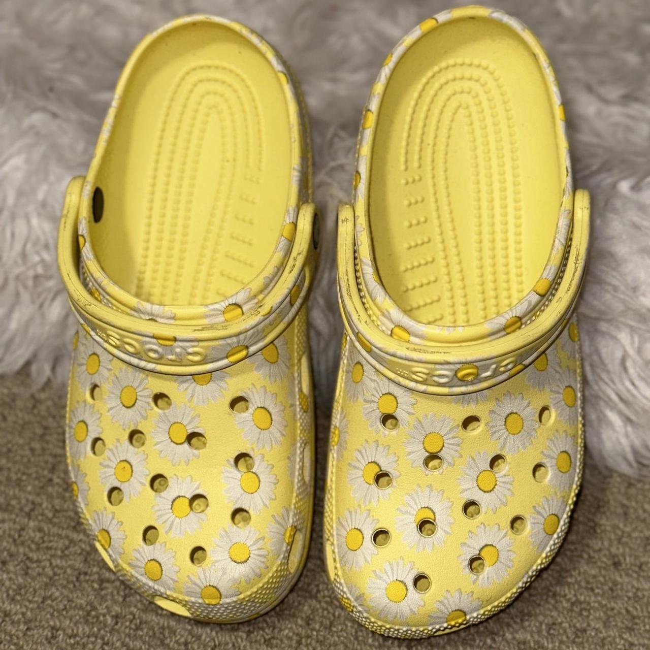 Yellow with white flowers CROCS. Worn a couple... - Depop