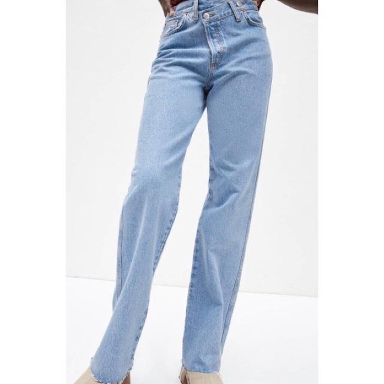 Cool jeans with crossed button detailing at... - Depop