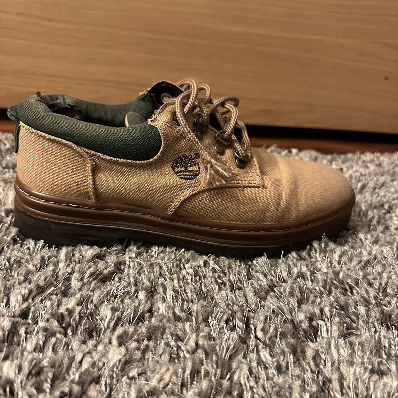 Low cut timbs with a little bit of tearing on the... - Depop