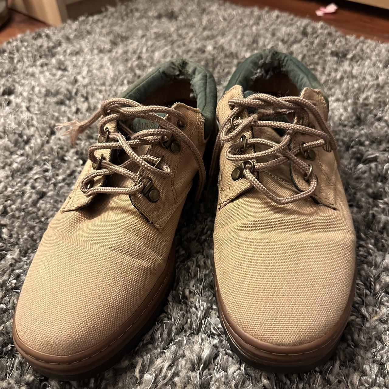 Low cut timbs with a little bit of tearing on the... - Depop