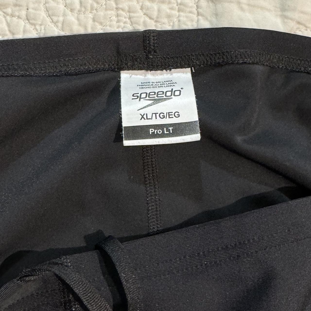 Speedo black swim shorts with blue stripe - Depop