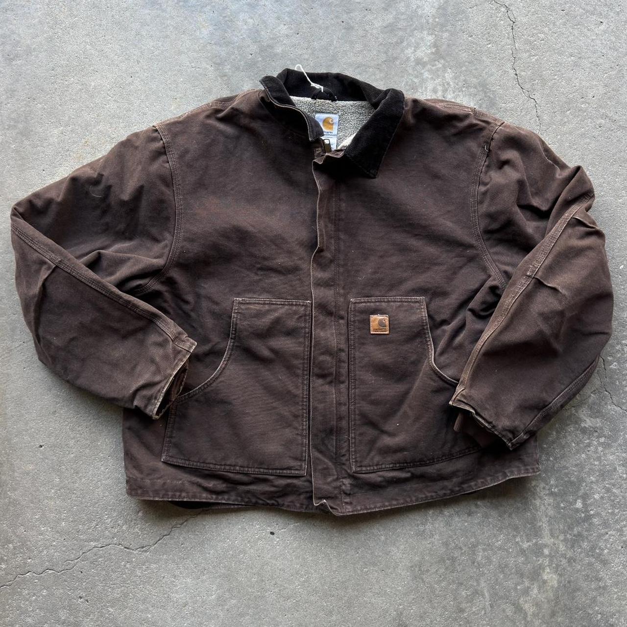 Brown Carhartt Detroit jacket with a worn faded J164... | Depop