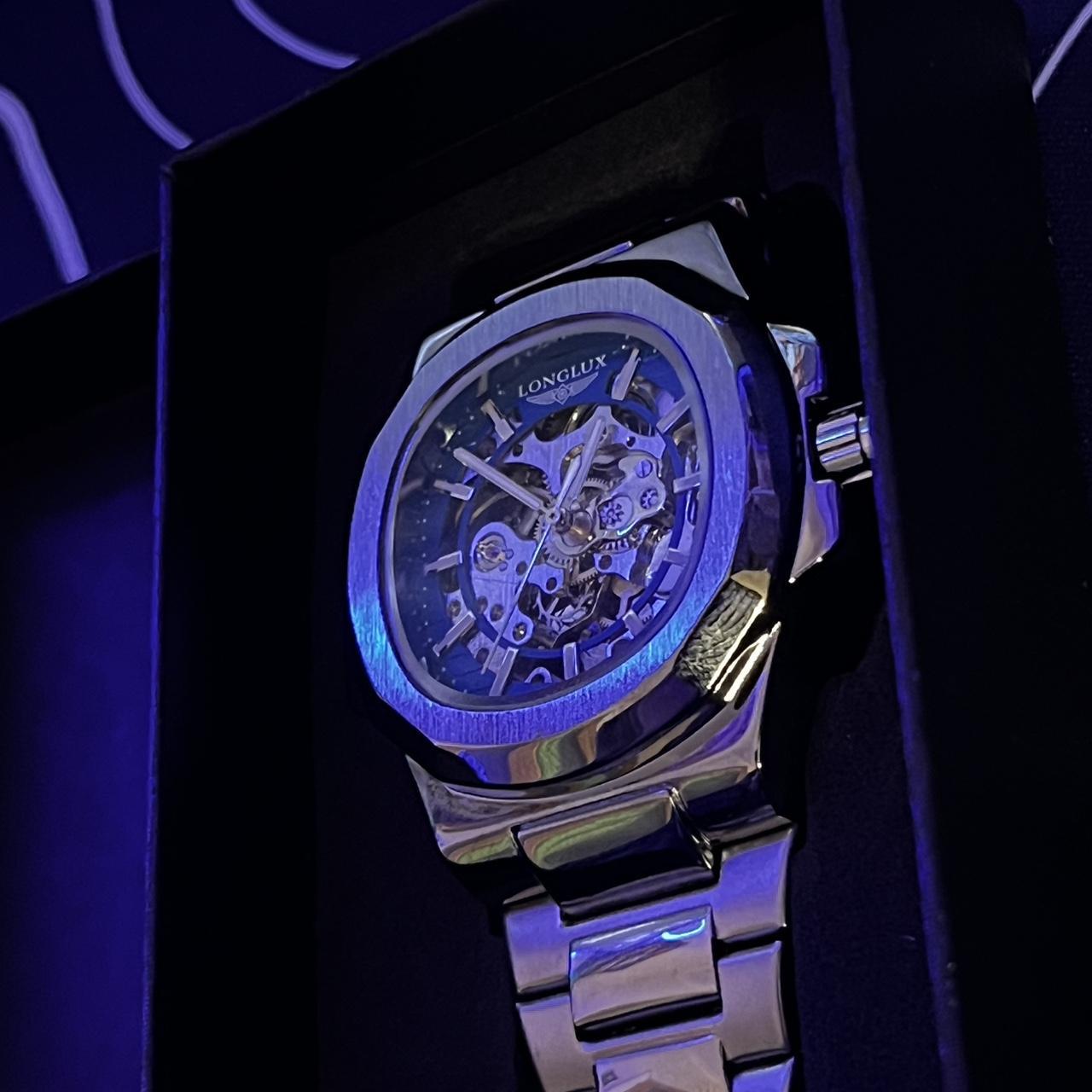 Silver automatic watch with moving parts inside ... - Depop