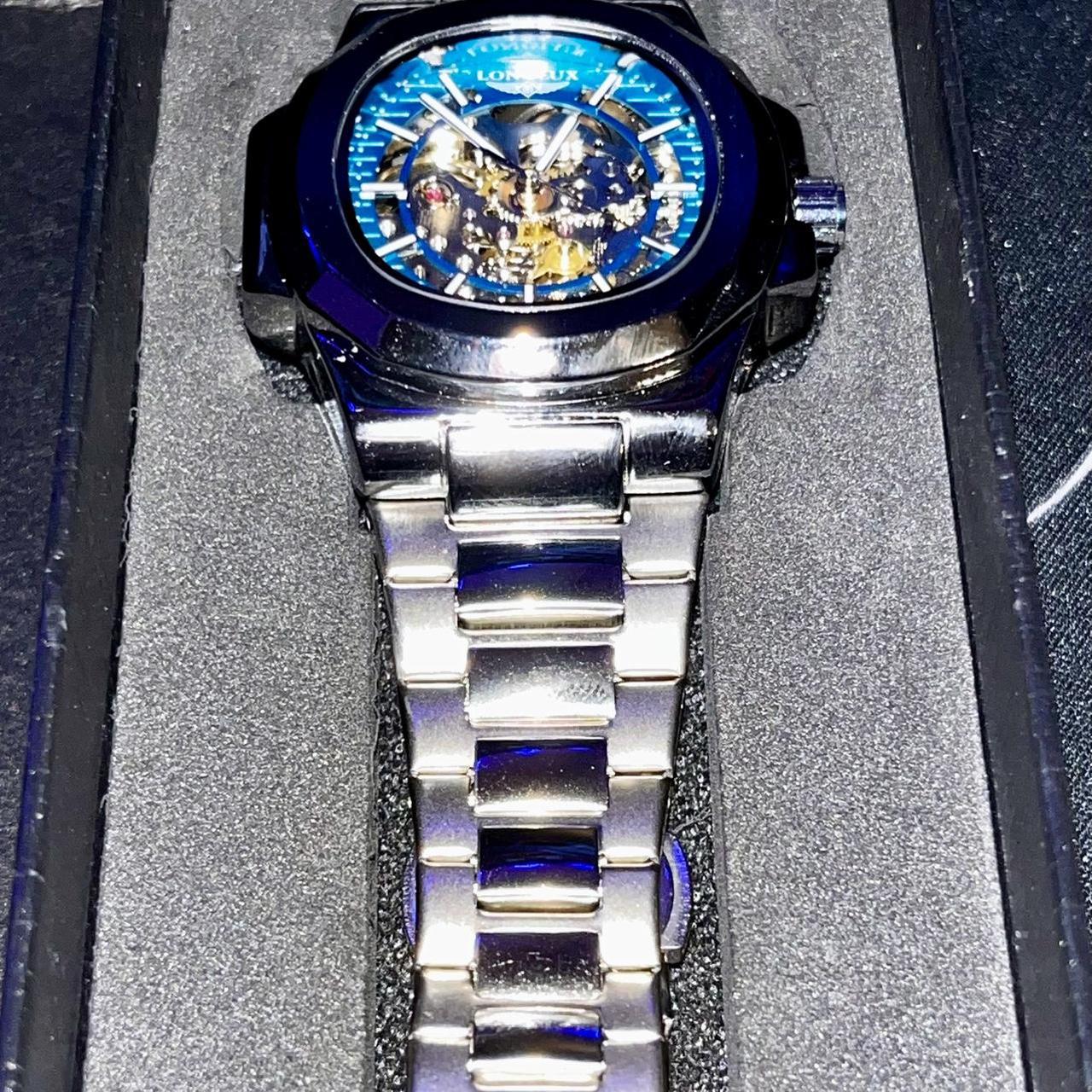 Silver automatic watch with moving parts inside ... - Depop