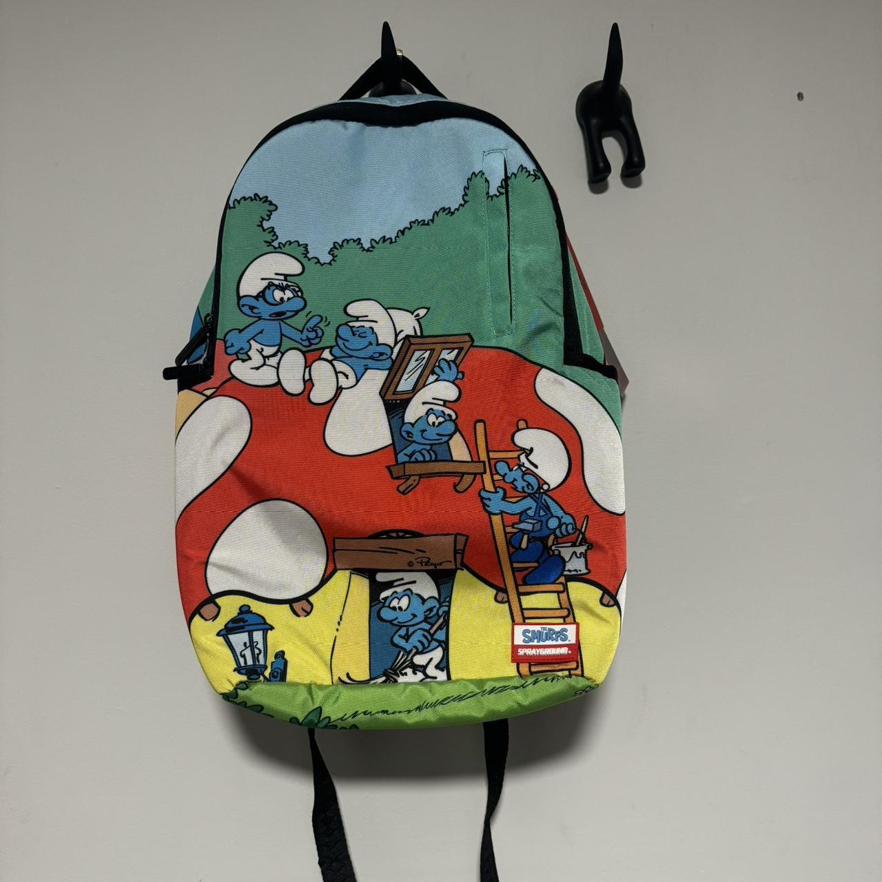 Smurfs backpack with a unique design, featuring a... - Depop