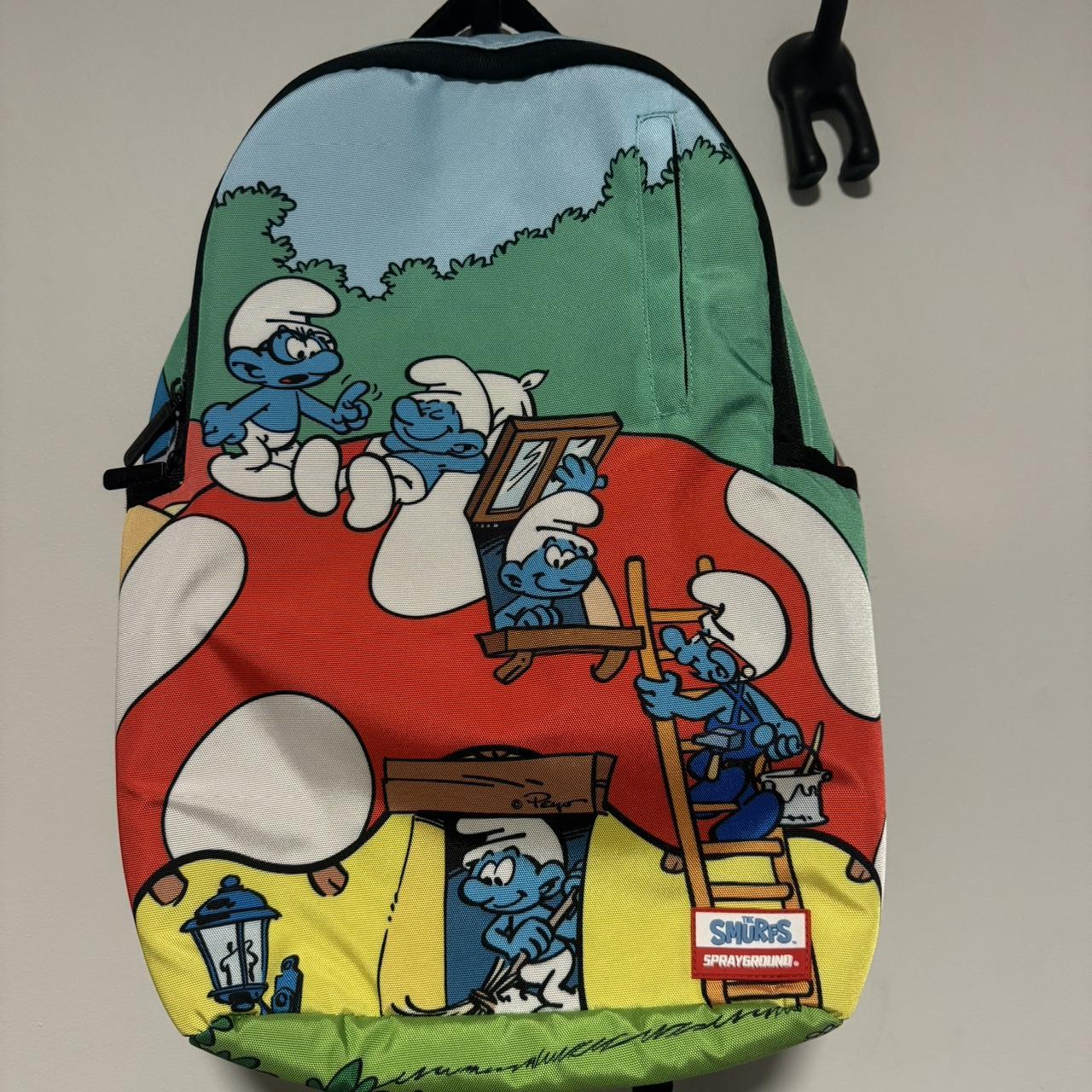 Smurfs backpack with a unique design, featuring a... - Depop
