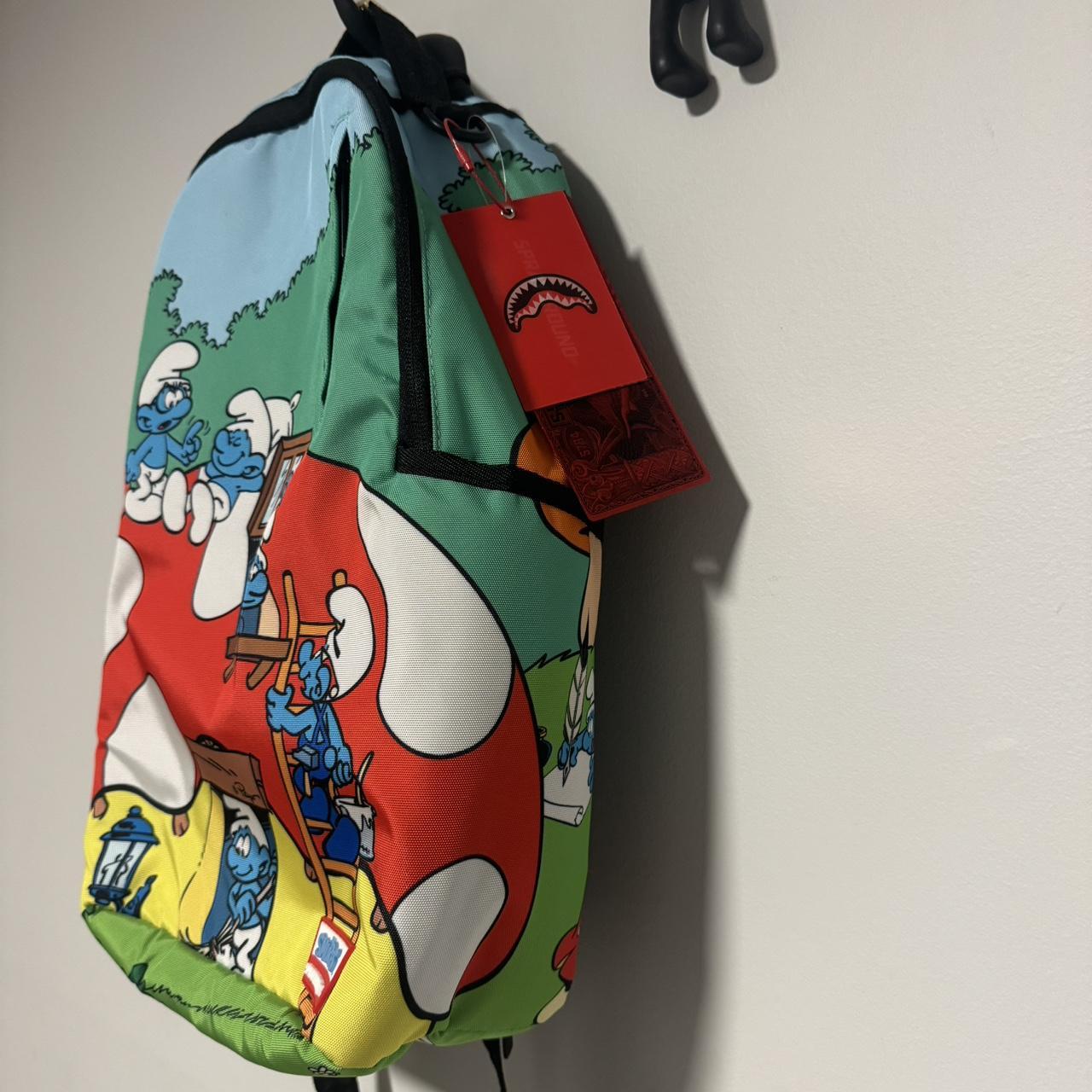 Smurfs backpack with a unique design, featuring a... - Depop