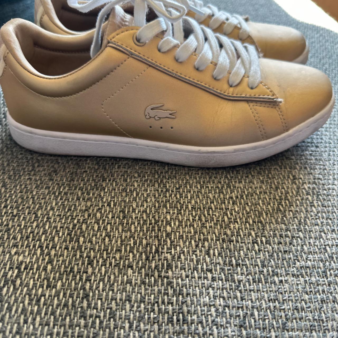 Woman’s gold la coste size 7 sneakers - Depop
