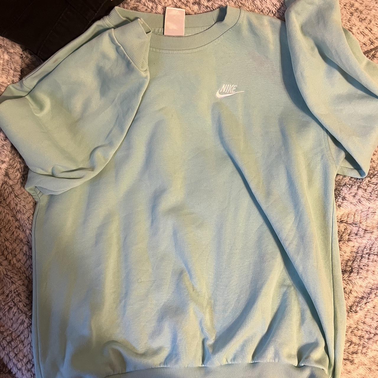cyan colored Nike crewneck it’s a XL in kids, but... - Depop