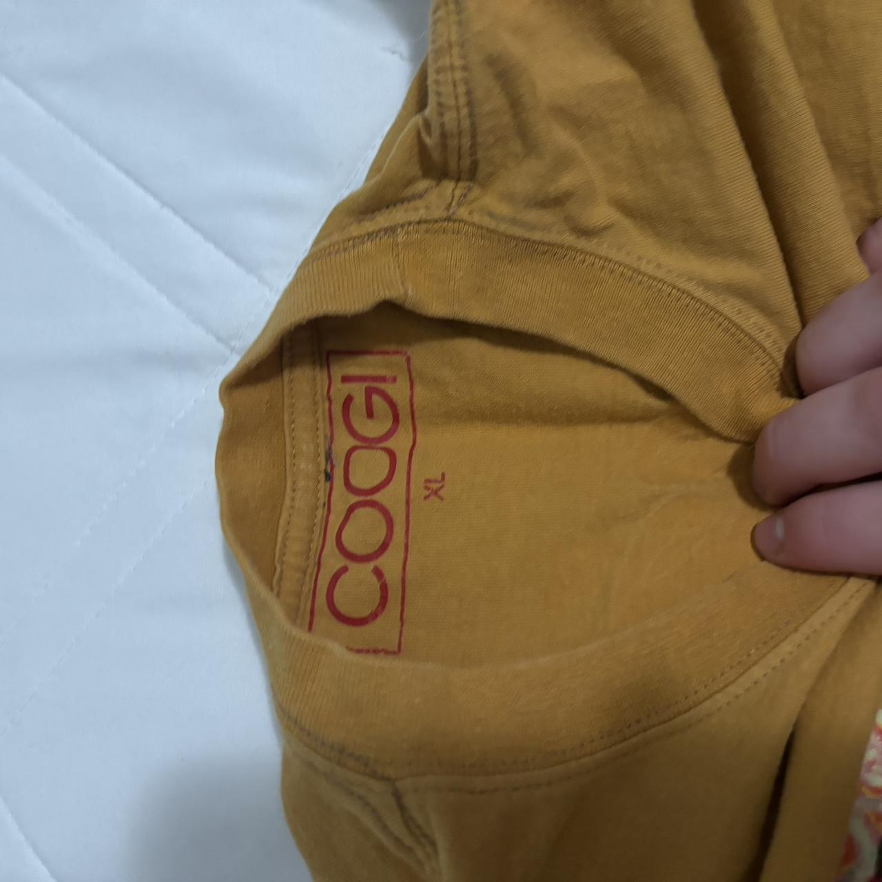 coogi graphic tshirt, cool design fits like... - Depop