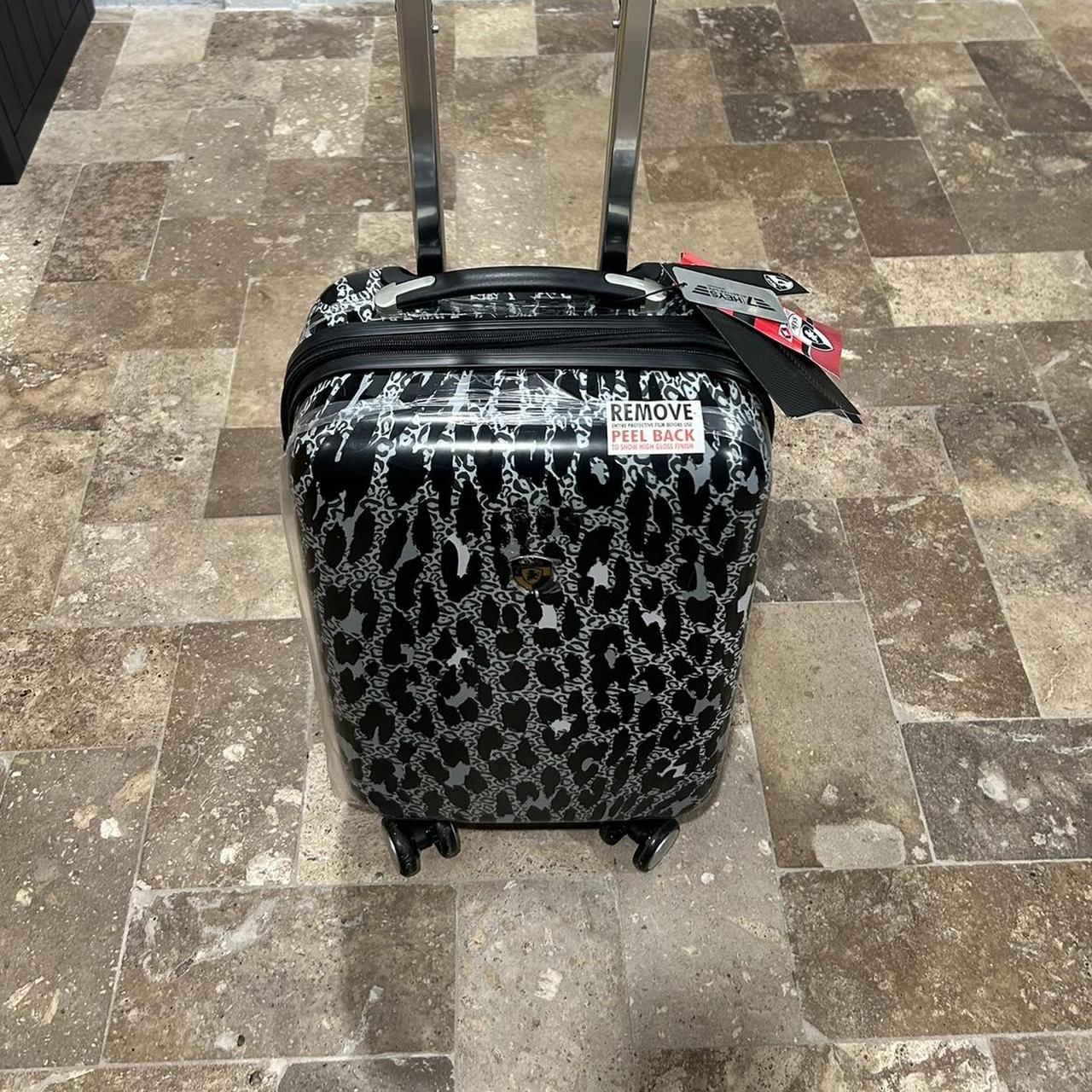 Black and white cheetah print hard shell carry on... | Depop