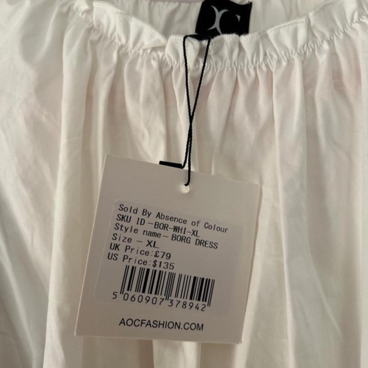 White dress from Absence Of Colour with faux leather... | Depop