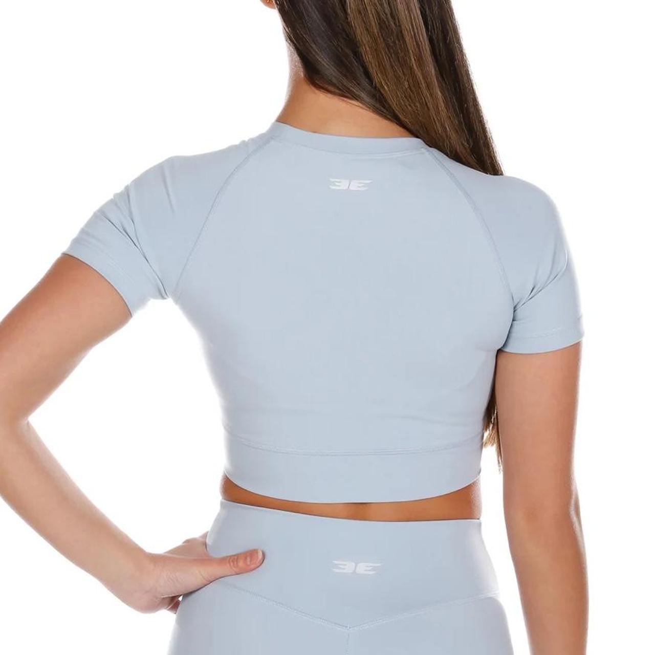 Elite eleven cross over tee in light blue size S - Depop