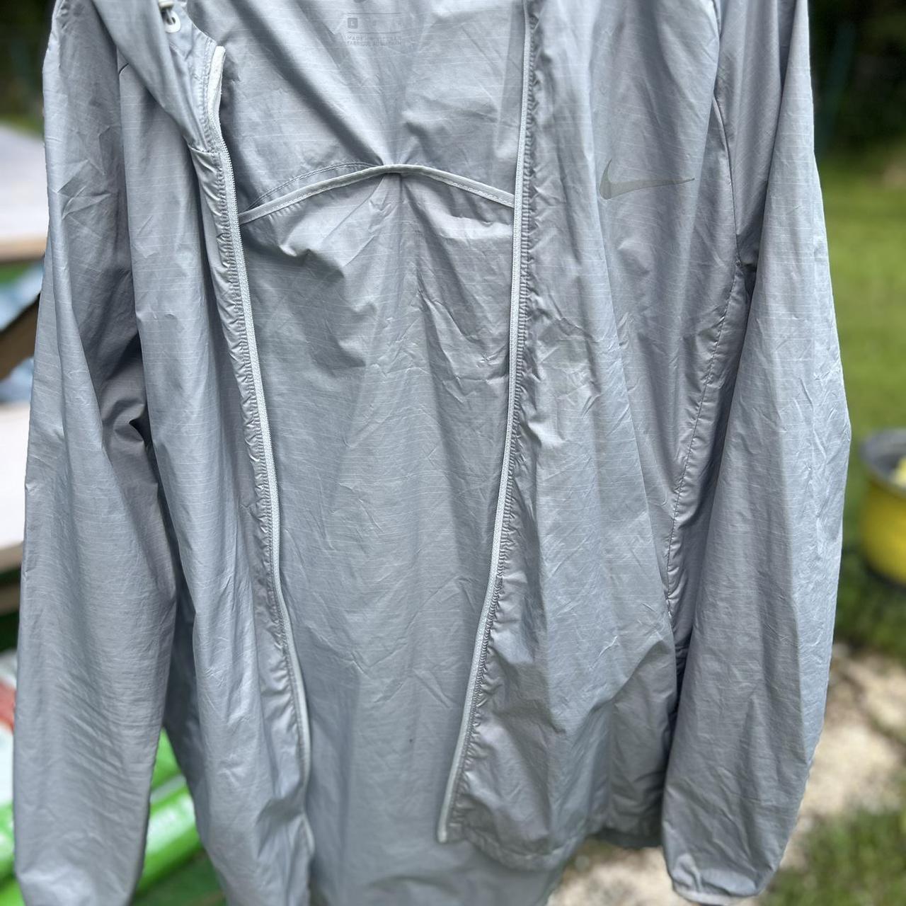Nike grey rain jacket - Depop