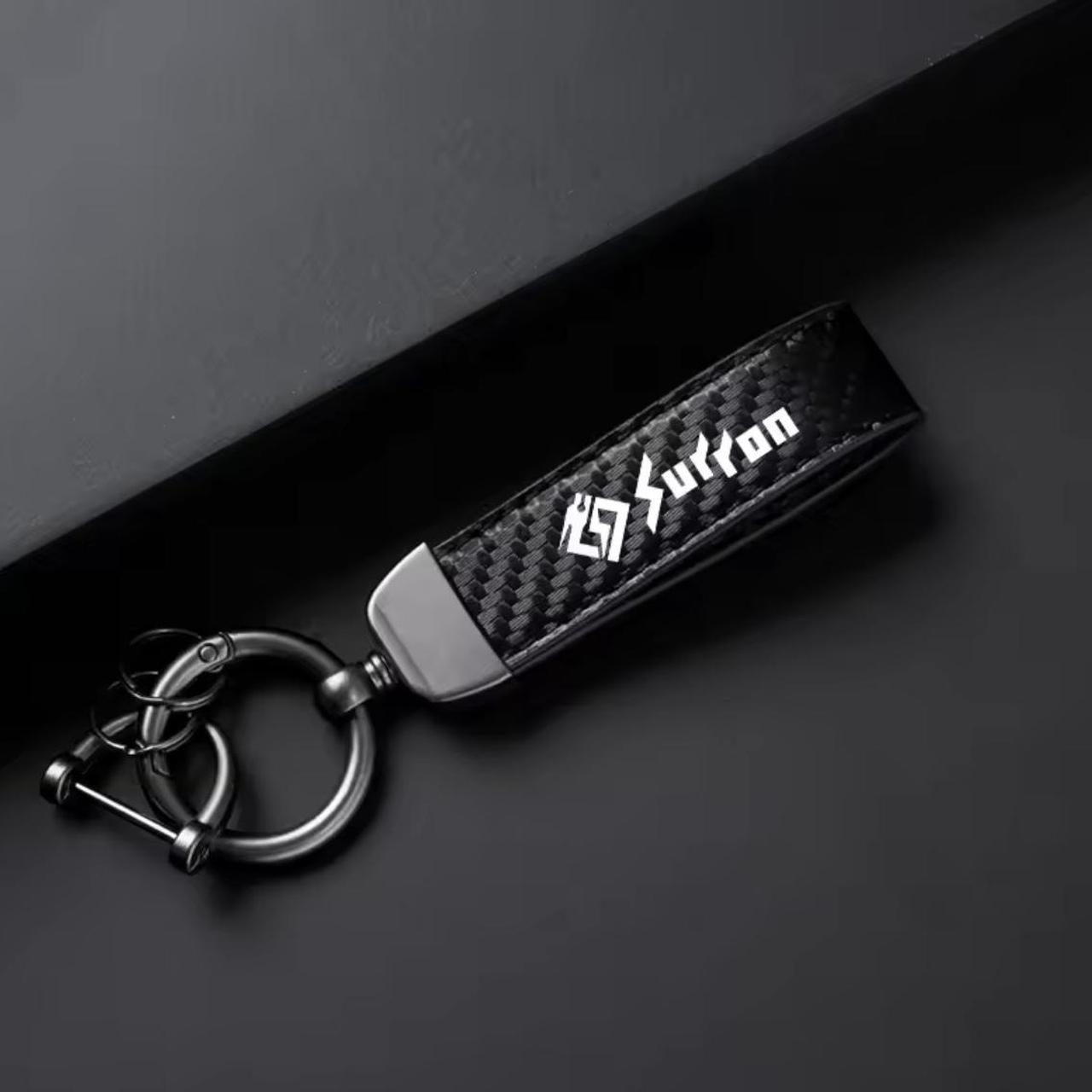 Carbon fibre black surron key chain Brand new Mint... | Depop