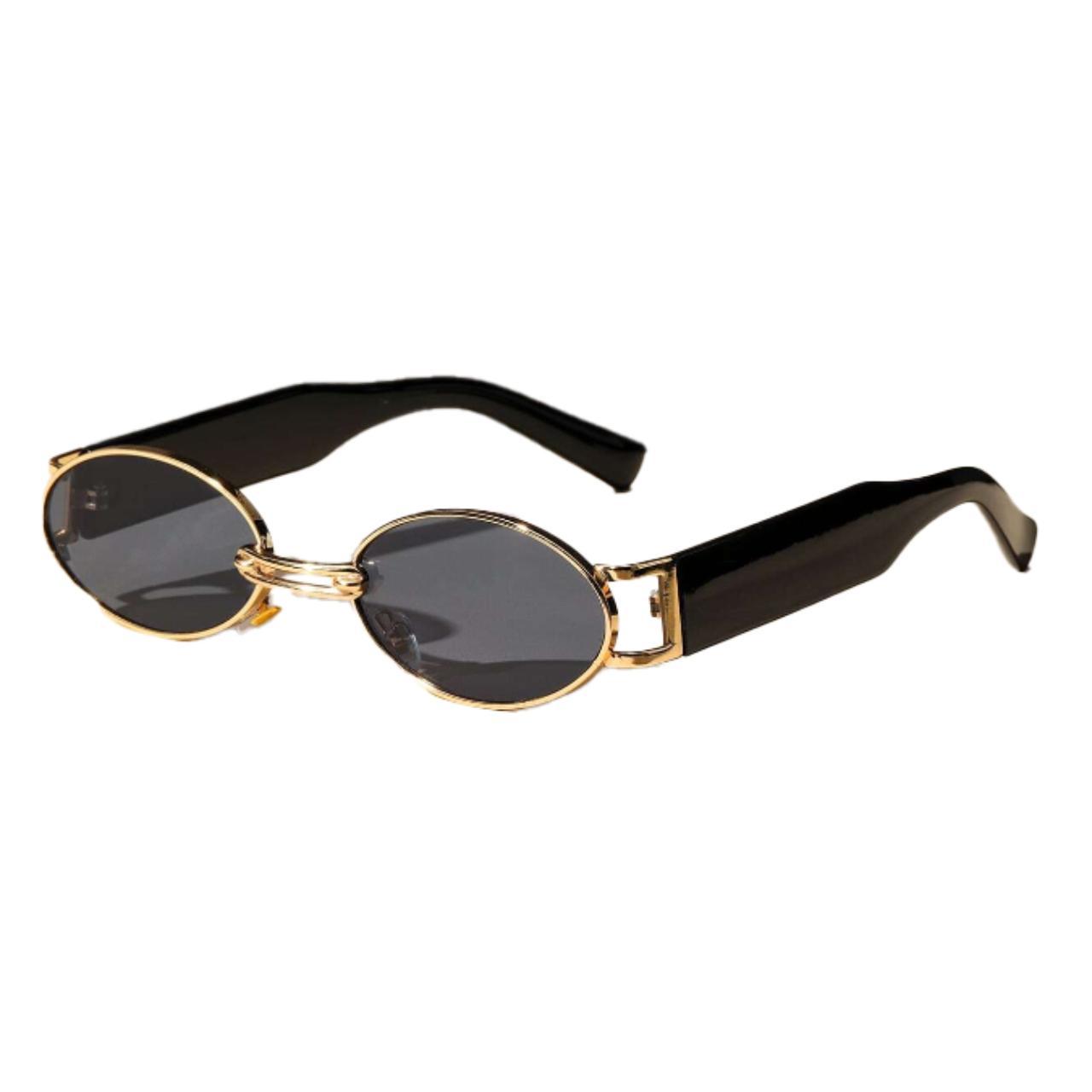 Black Oval Shaped Glasses with Gold Detailing - Depop