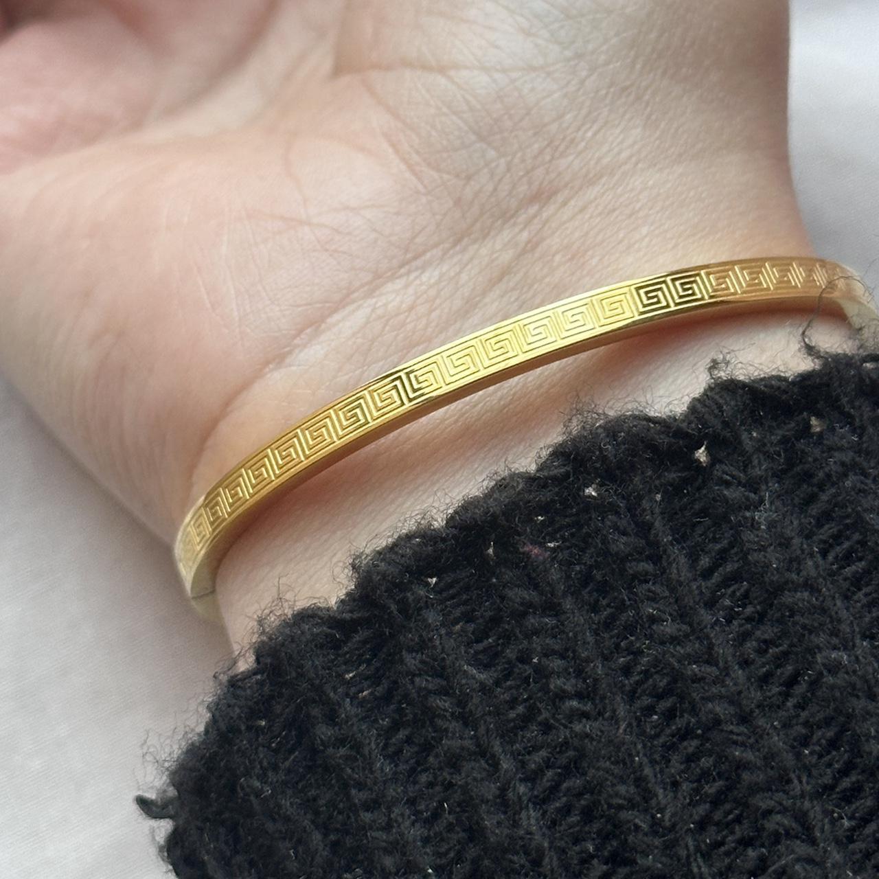 Beautiful gold clasp bangle with engraved detailing... - Depop