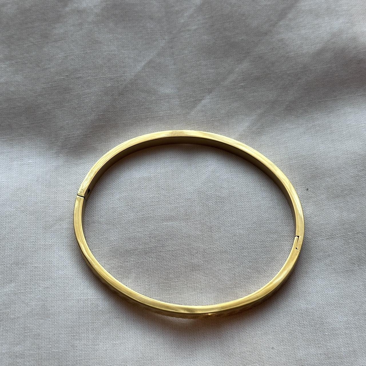 Beautiful gold clasp bangle with engraved detailing... - Depop