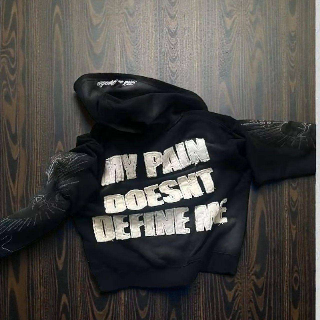 Black zip-up hoodie with embroidered heart graphics... | Depop