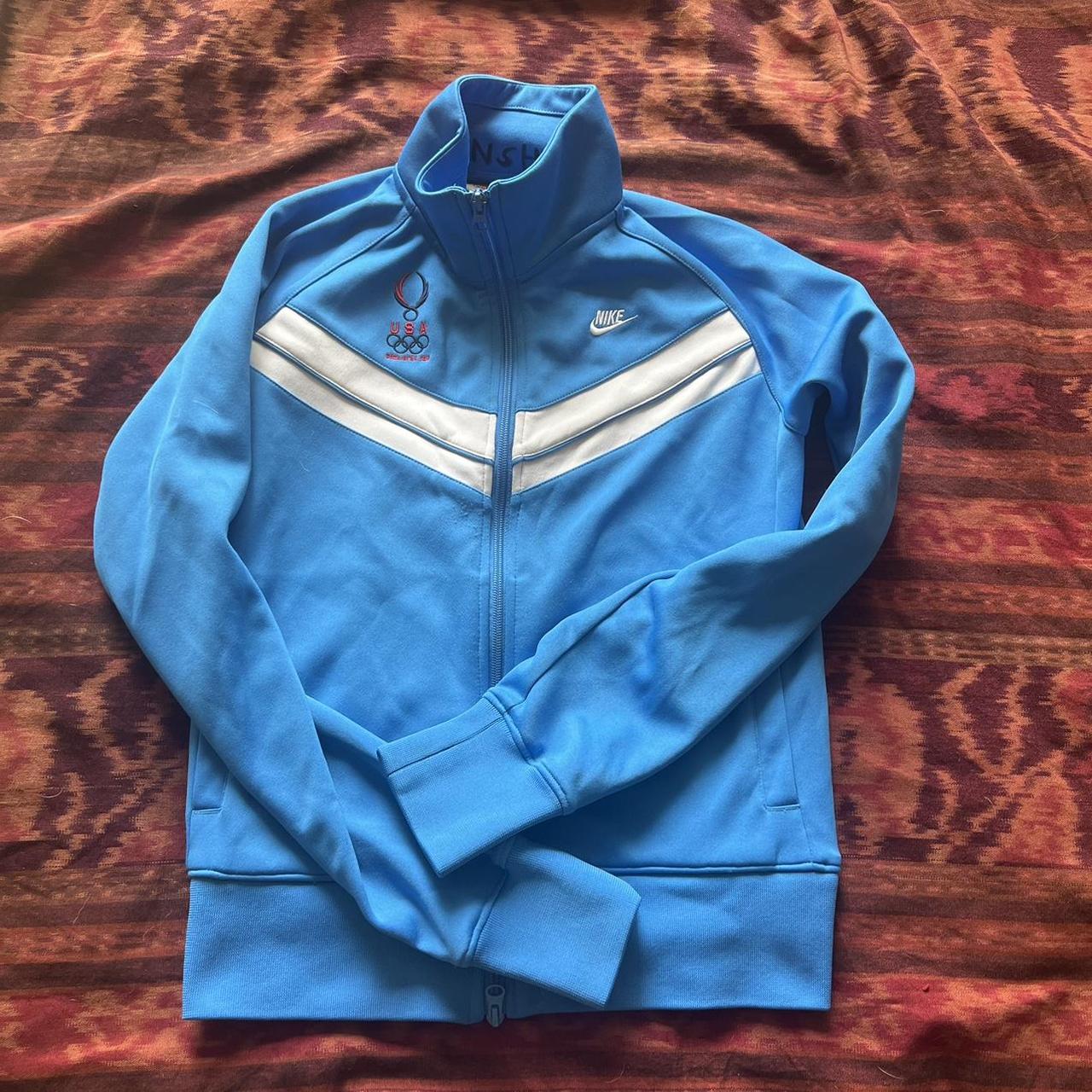 Nike blue and white track jacket Olympics Listed... - Depop