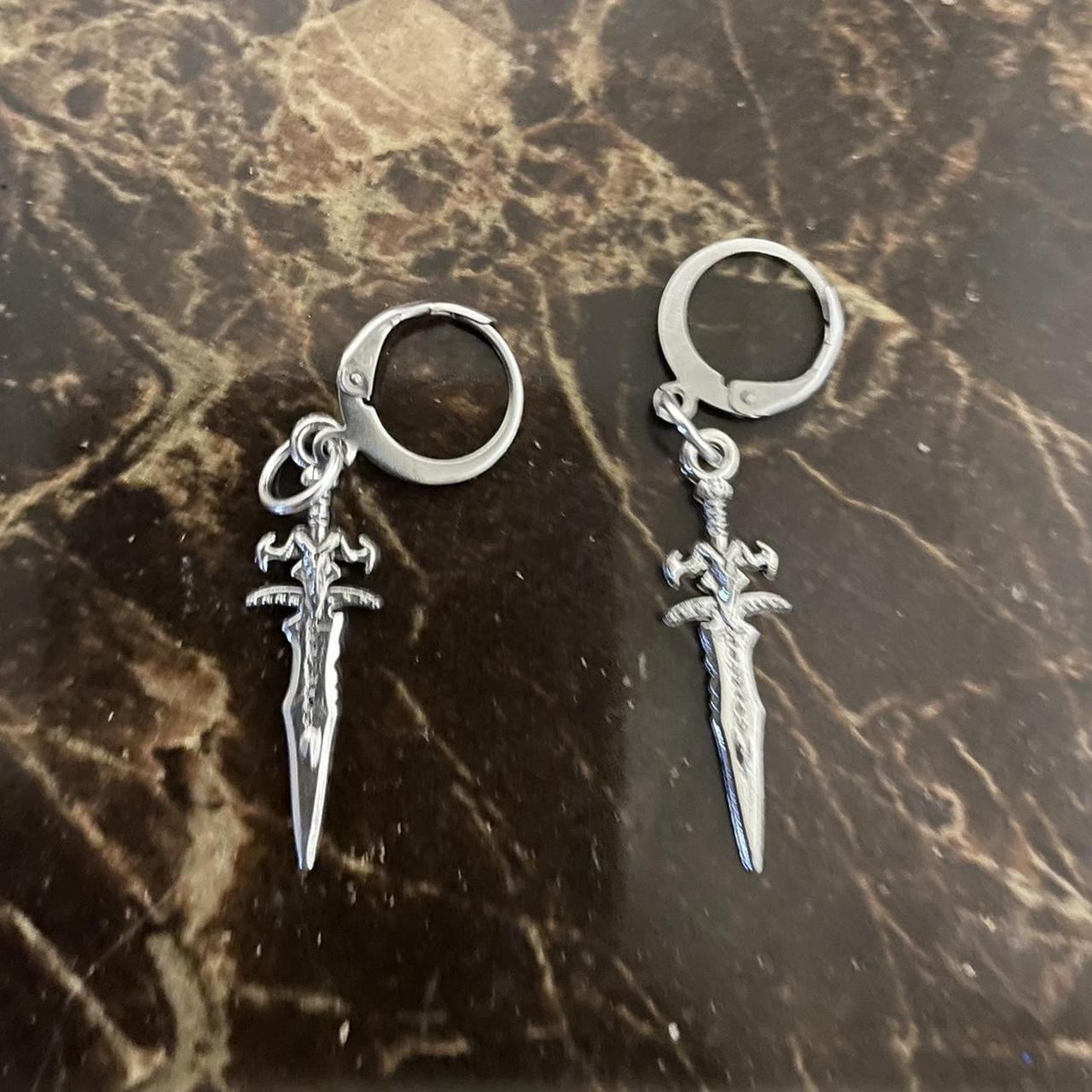 dangle sword earring pair. - Depop