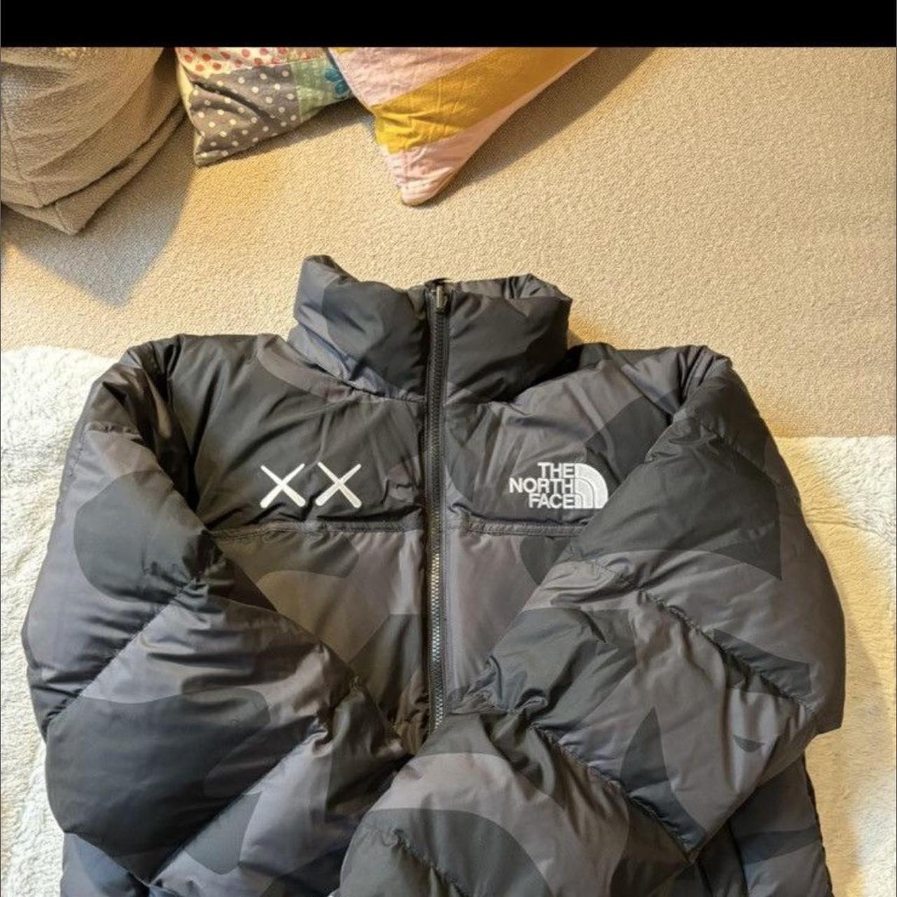 KAWS x The North Face puffer jacket in black and... - Depop